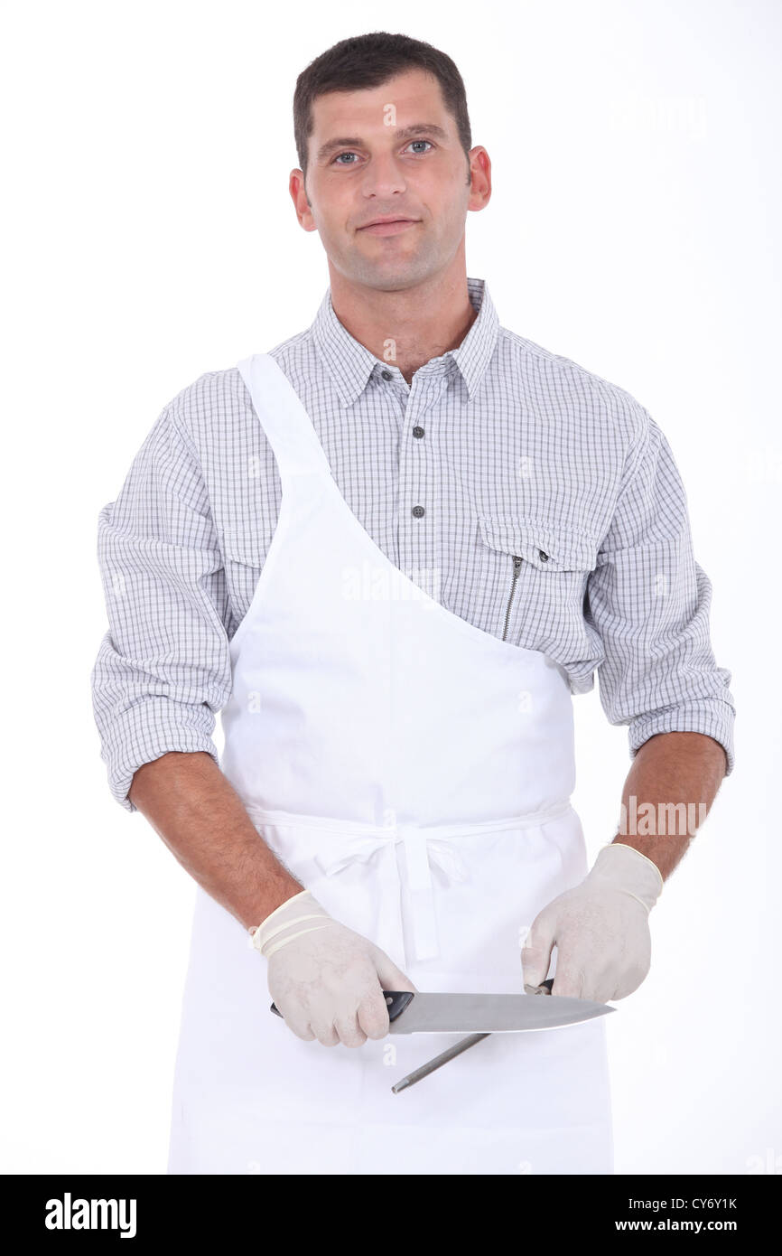 butcher sharpening his knife Stock Photo - Alamy