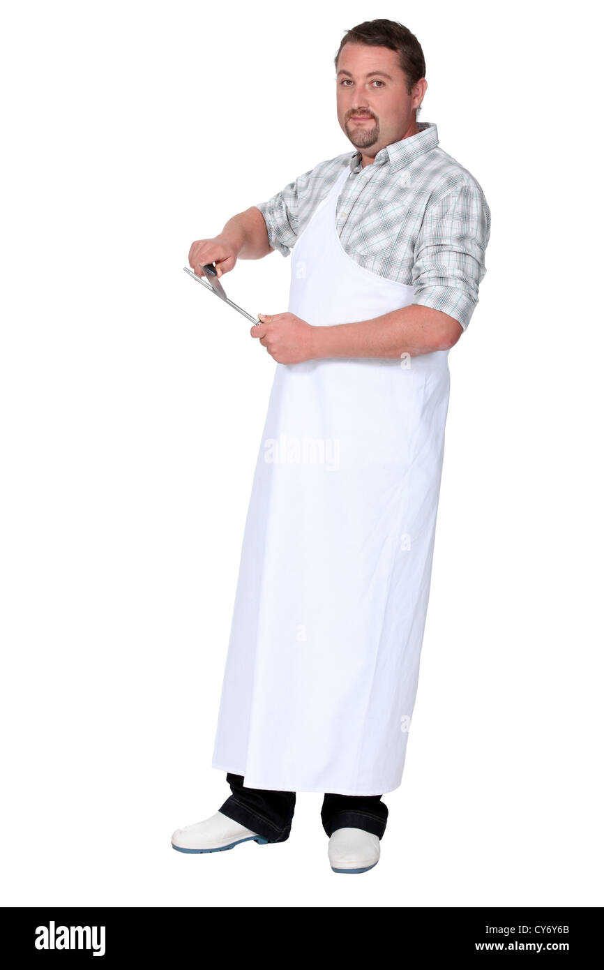 Man sharpening knife Stock Photo - Alamy