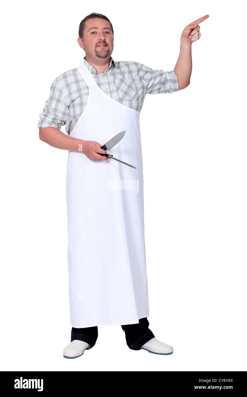 Male chef holding knife and pointing Stock Photo - Alamy
