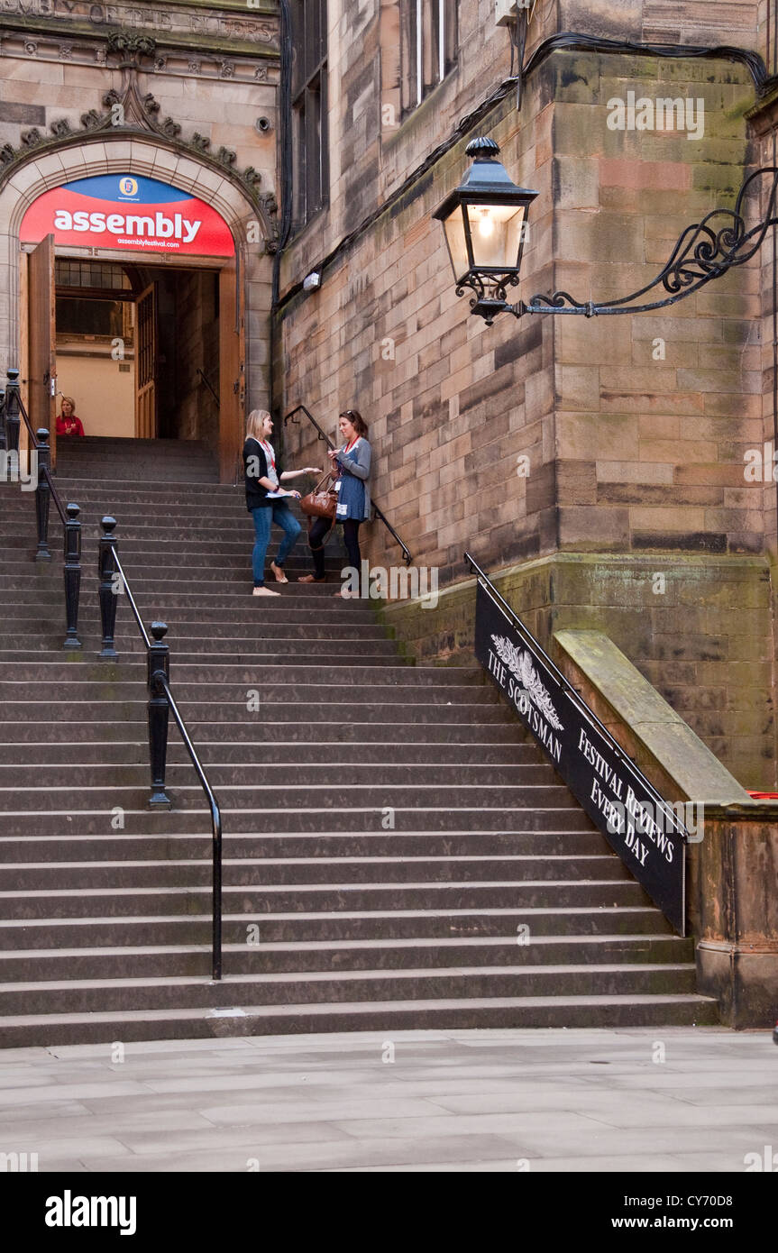 Women talking on steps of the Assembly Hall, Edinburgh Stock Photo - Alamy
