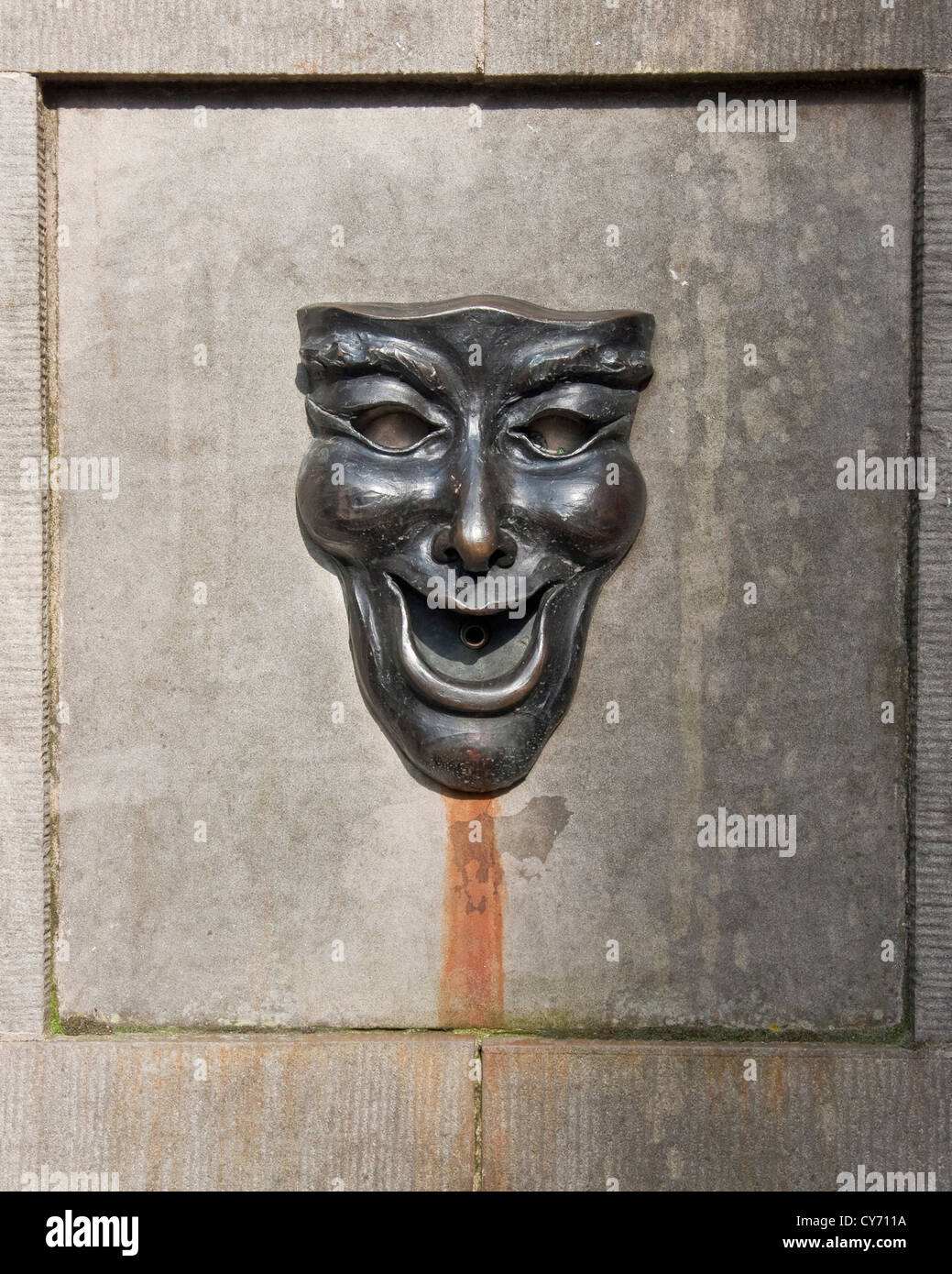 Theatrical mask sculpture on fountain on High Street,Central Edinburgh ...