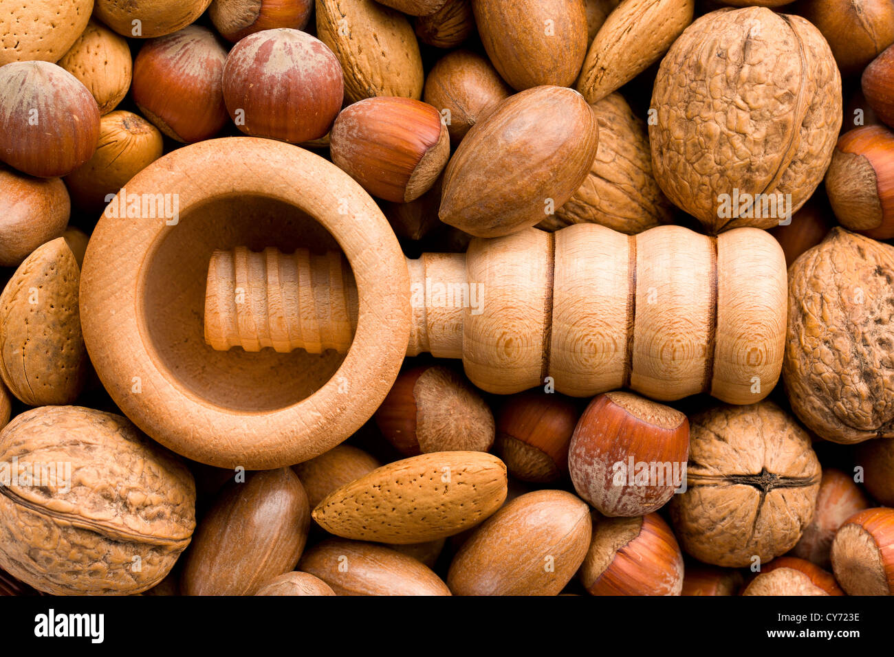 wooden nutcracker and various nuts Stock Photo - Alamy