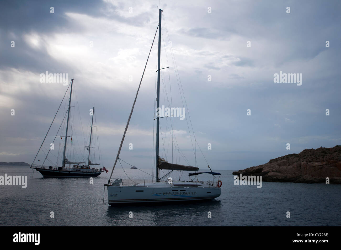Two sailing ships anchored in the Spanish Island of Ibiza Stock Photo ...