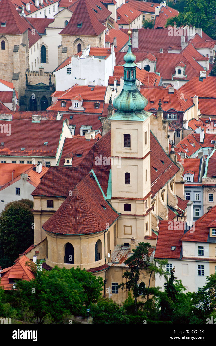 View on roofs of ancient buildings and church of Prague old town in ...