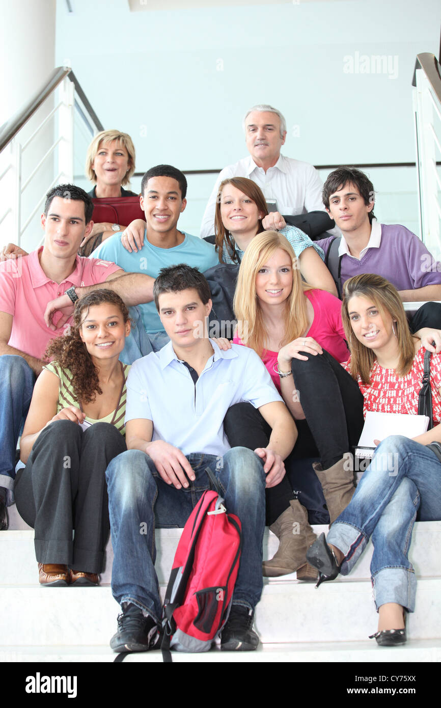 Students sat on school steps Stock Photo - Alamy