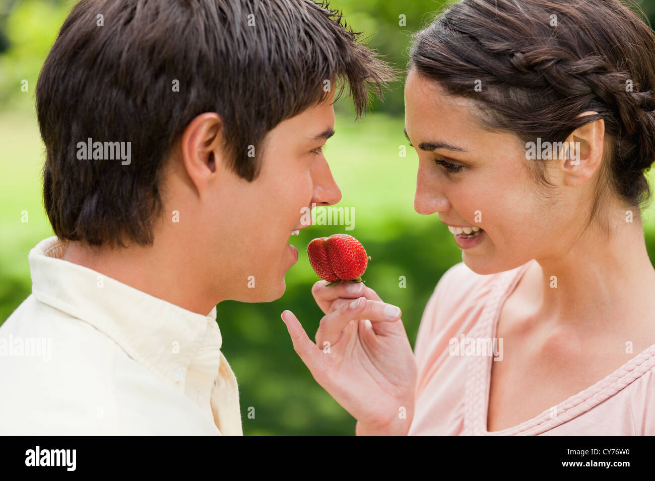 Happy cute couple strawberry fruit hi-res stock photography and images ...