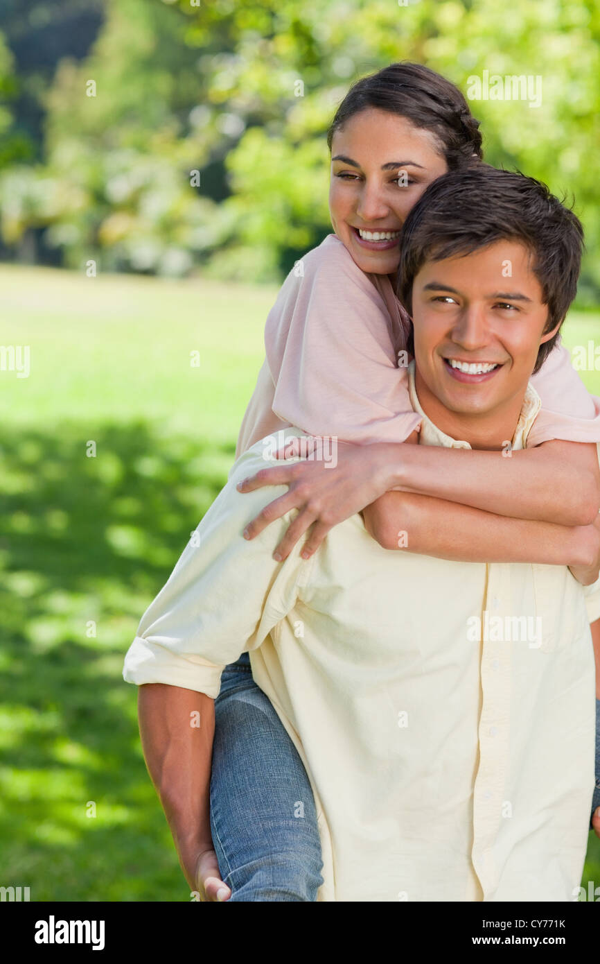 Happy young couple arms wrapped hi-res stock photography and images - Alamy