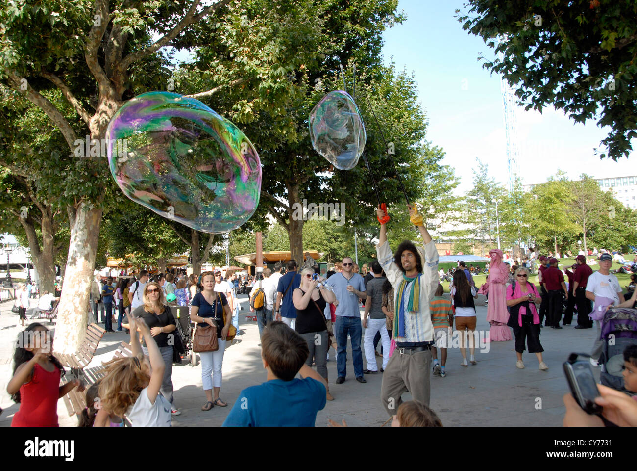 Street performer busking on South Bank arts complex, London, UK Stock ...
