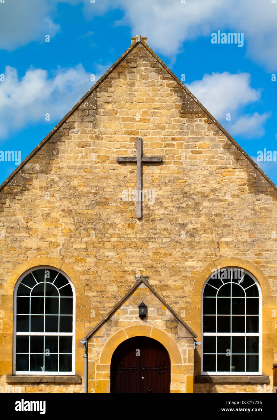 Detail of a chapel building with arched windows and crucifix in ...