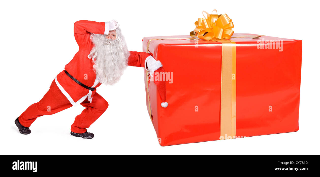 Santa Claus pulls Christmas box Stock Photo - Alamy