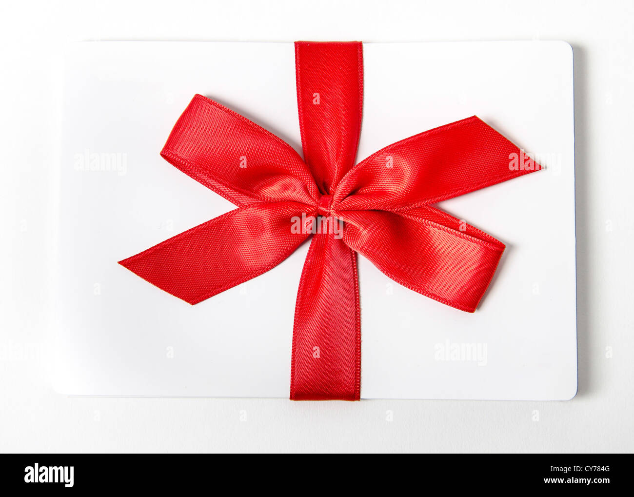 Gift box with red bow isolated on white background Stock Photo - Alamy
