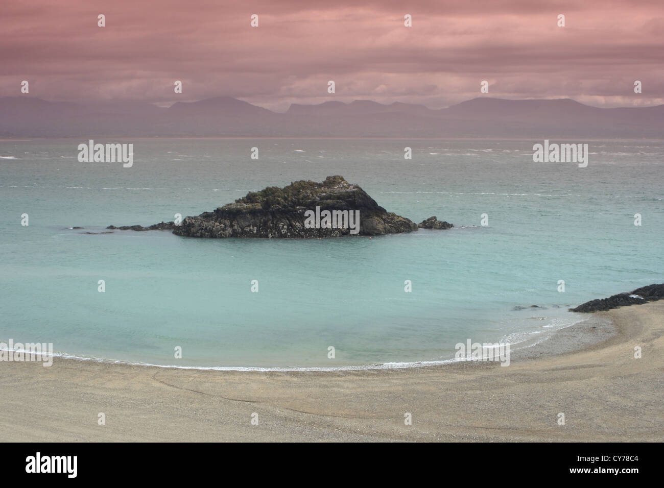 The rocks of ynys y clochydd in sea off Llanddwynn Island Anglesey ...