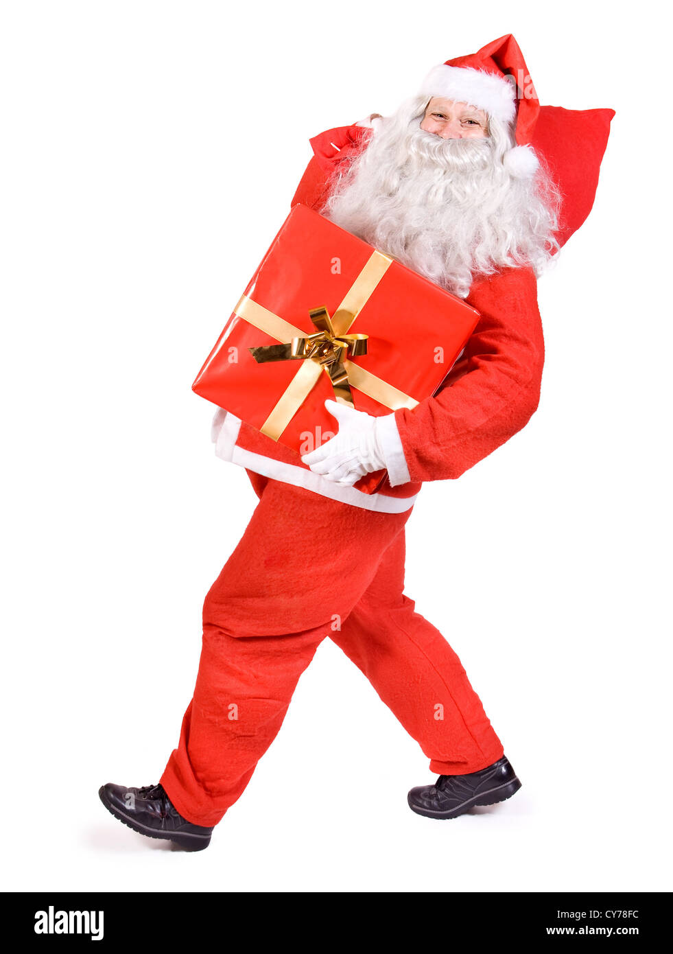 Santa Claus with Christmas gift Stock Photo - Alamy