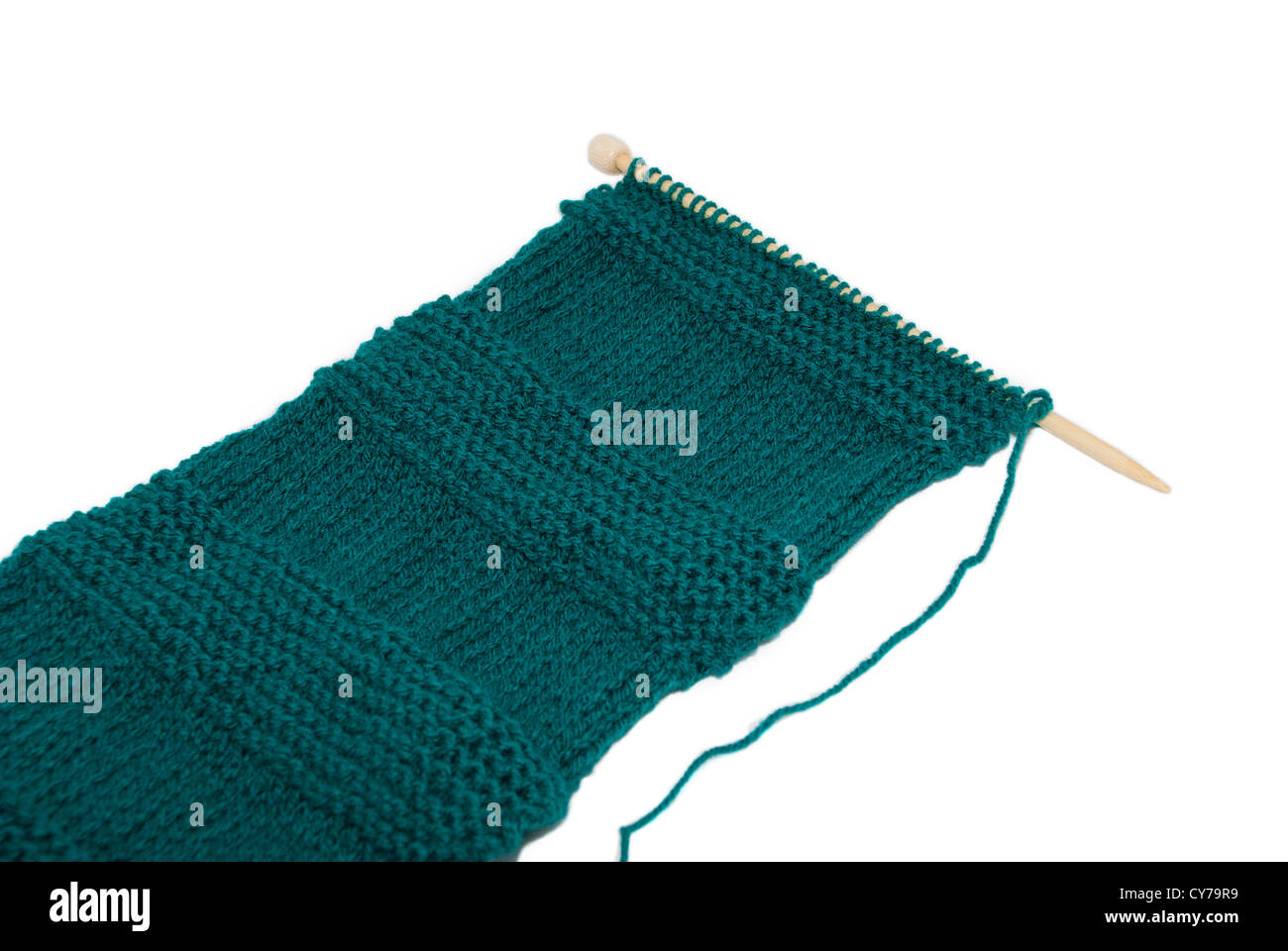 Unfinished scarf on knitting needle in stocking and garter stitch Stock ...