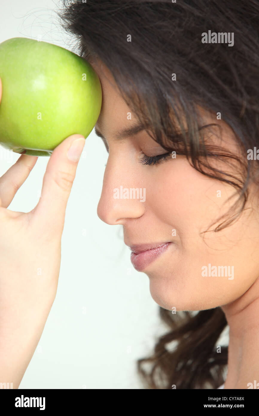Woman with an apple Stock Photo - Alamy