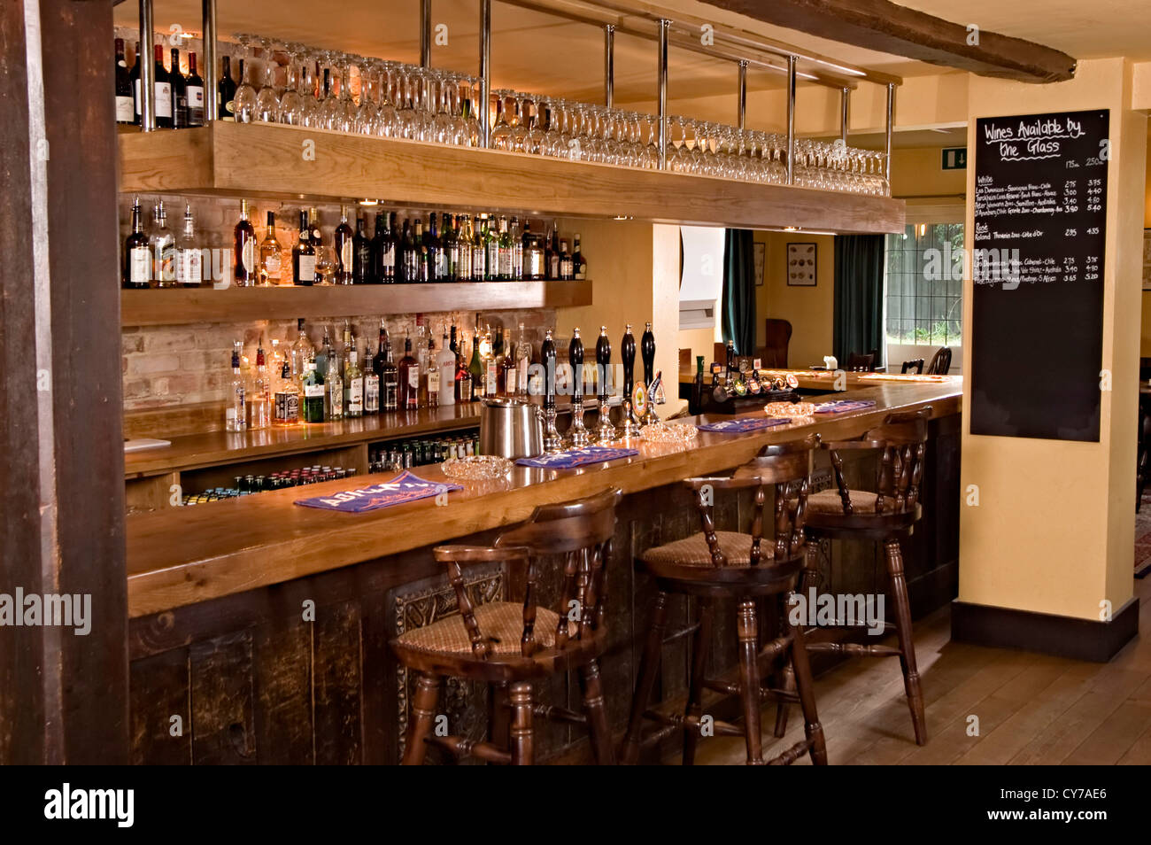 the Harcourt pub bar and beer pumps and stools Stock Photo - Alamy