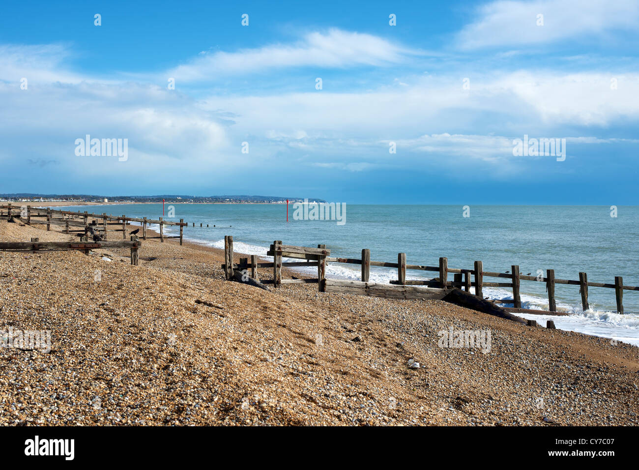 Groynes sea beach and approaching storm clouds in the sky at Pevensey ...