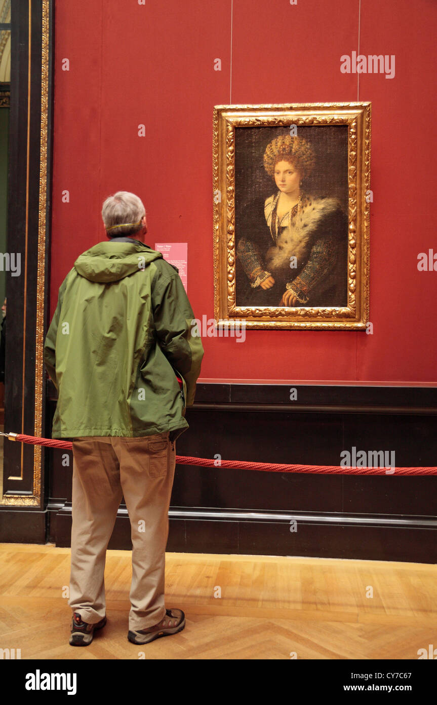 Visitor admiring the portrait of Isabella d'Este by Titian in the ...