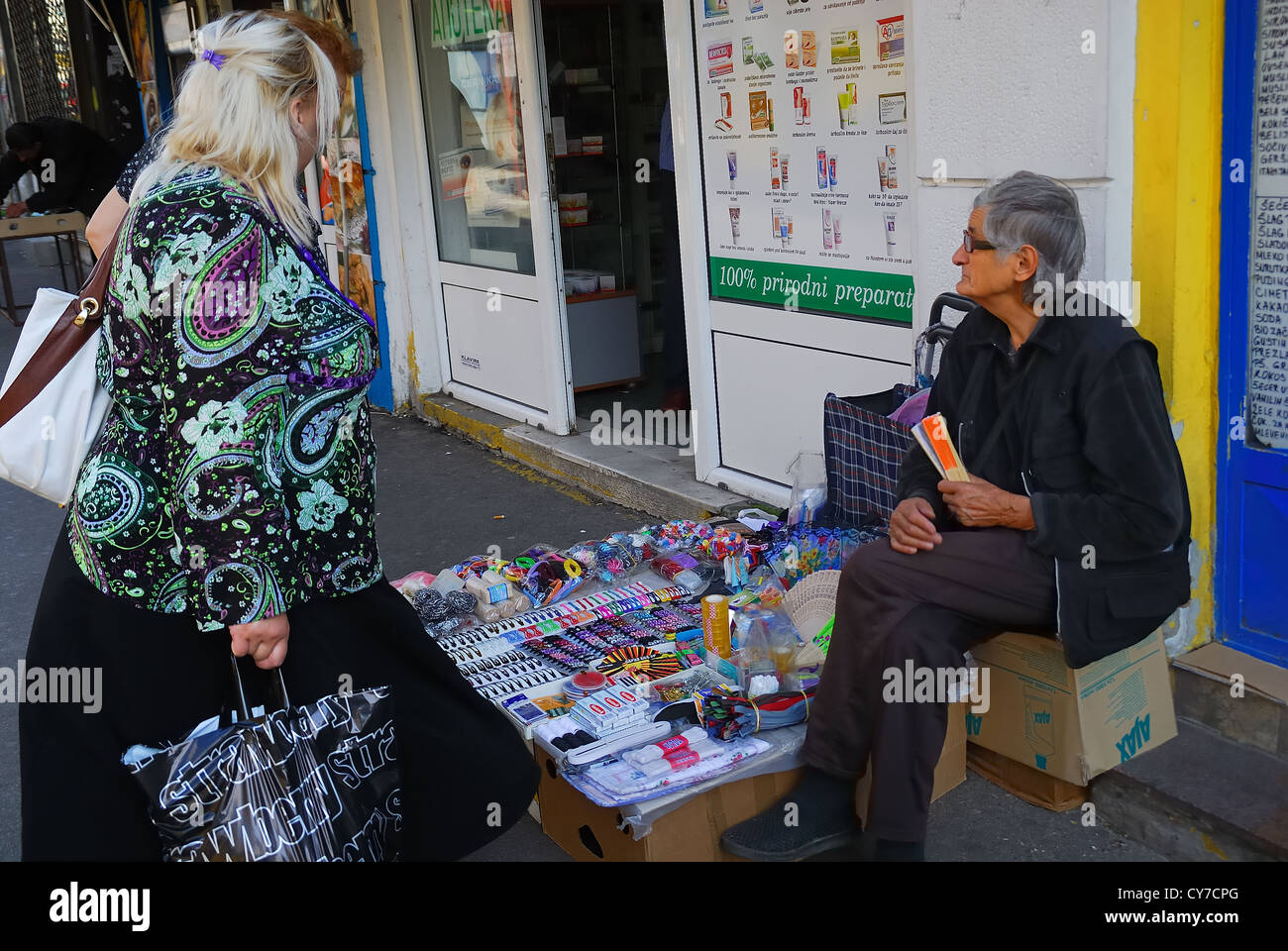 Woman street peddler hi-res stock photography and images - Alamy