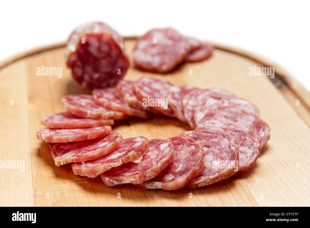 sliced salami in circle shape on cutting board Stock Photo - Alamy