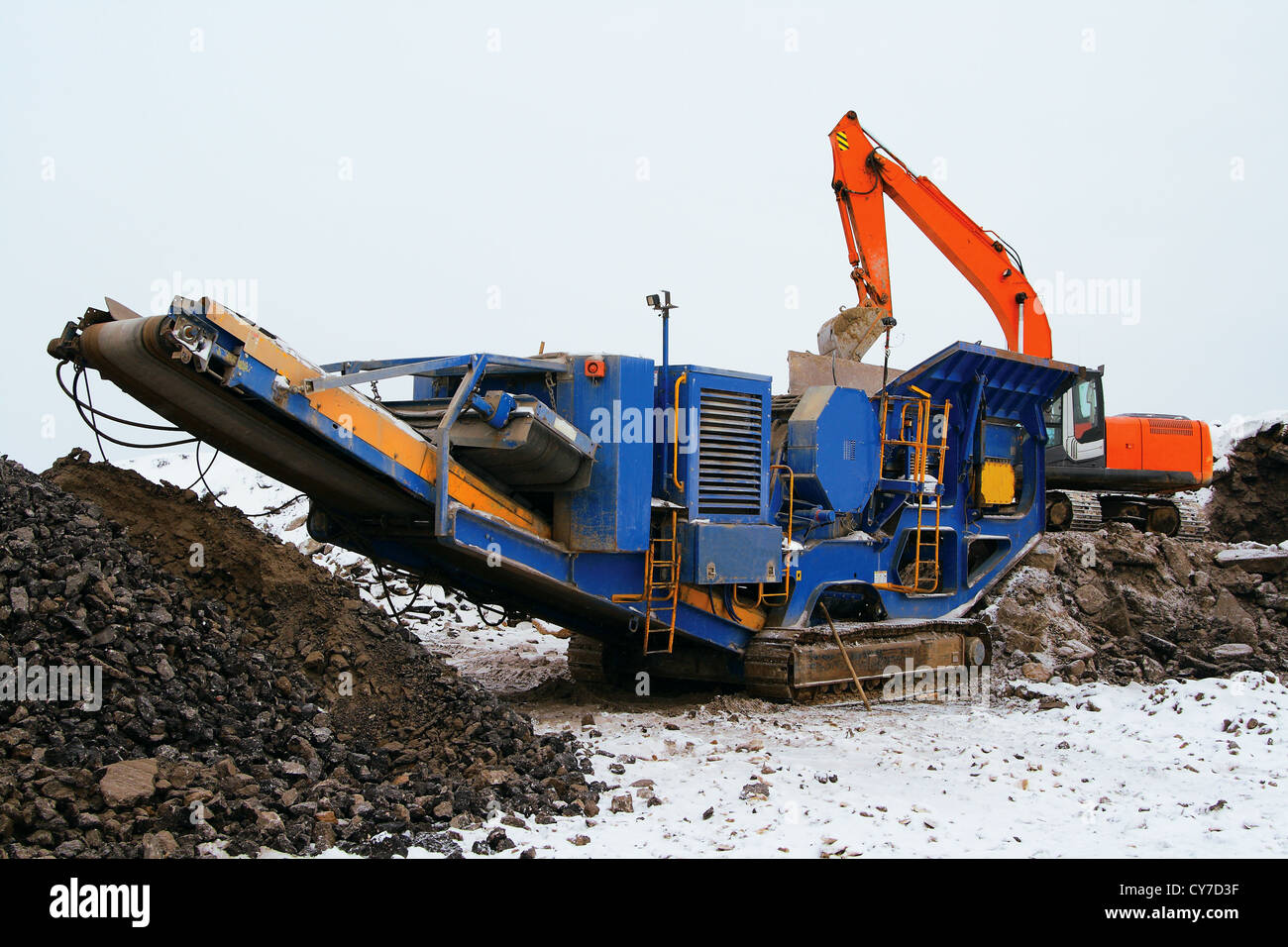 Machine for crushing stone construction waste Stock Photo - Alamy
