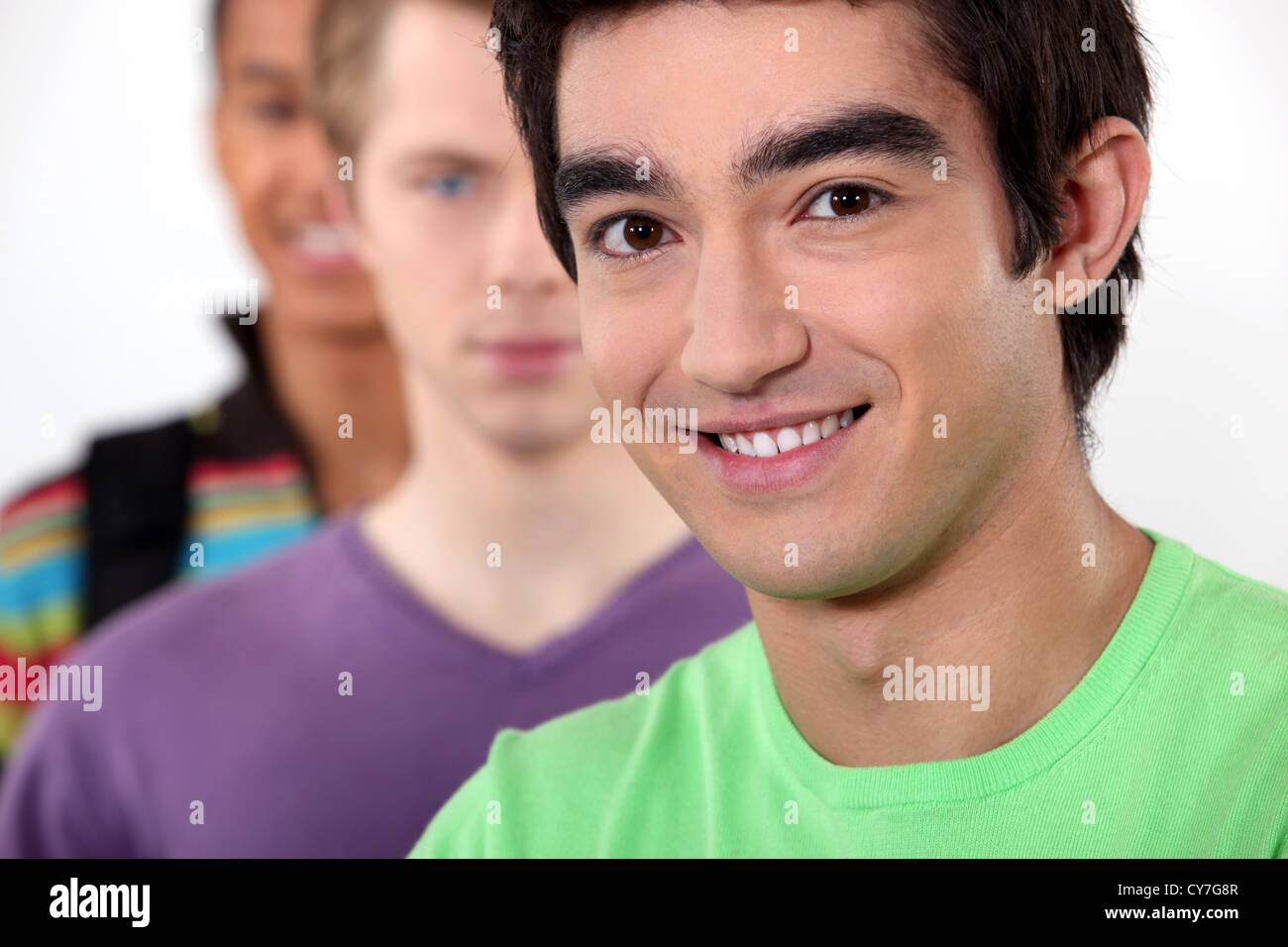 Three young men Stock Photo - Alamy