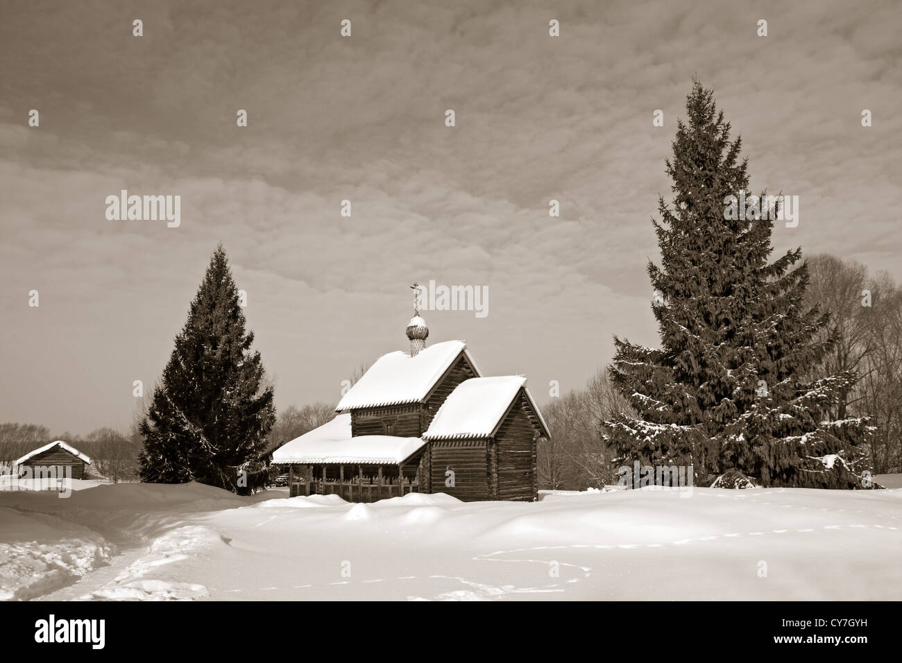 wooden chapel in winter village, sepia Stock Photo - Alamy