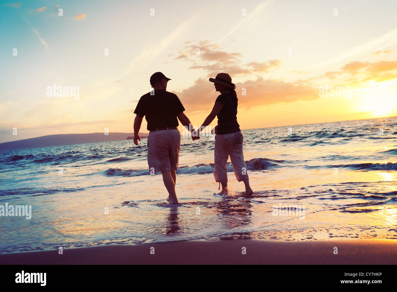 Senior Couple Enjoying Sunset at the Beach Stock Photo - Alamy