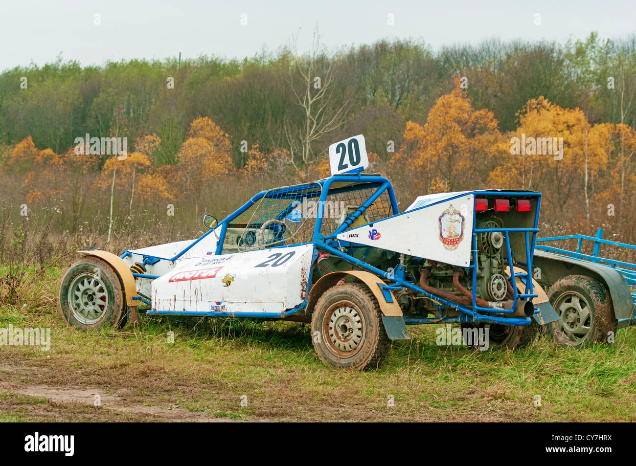 White buggy-car near autumn forest Stock Photo - Alamy