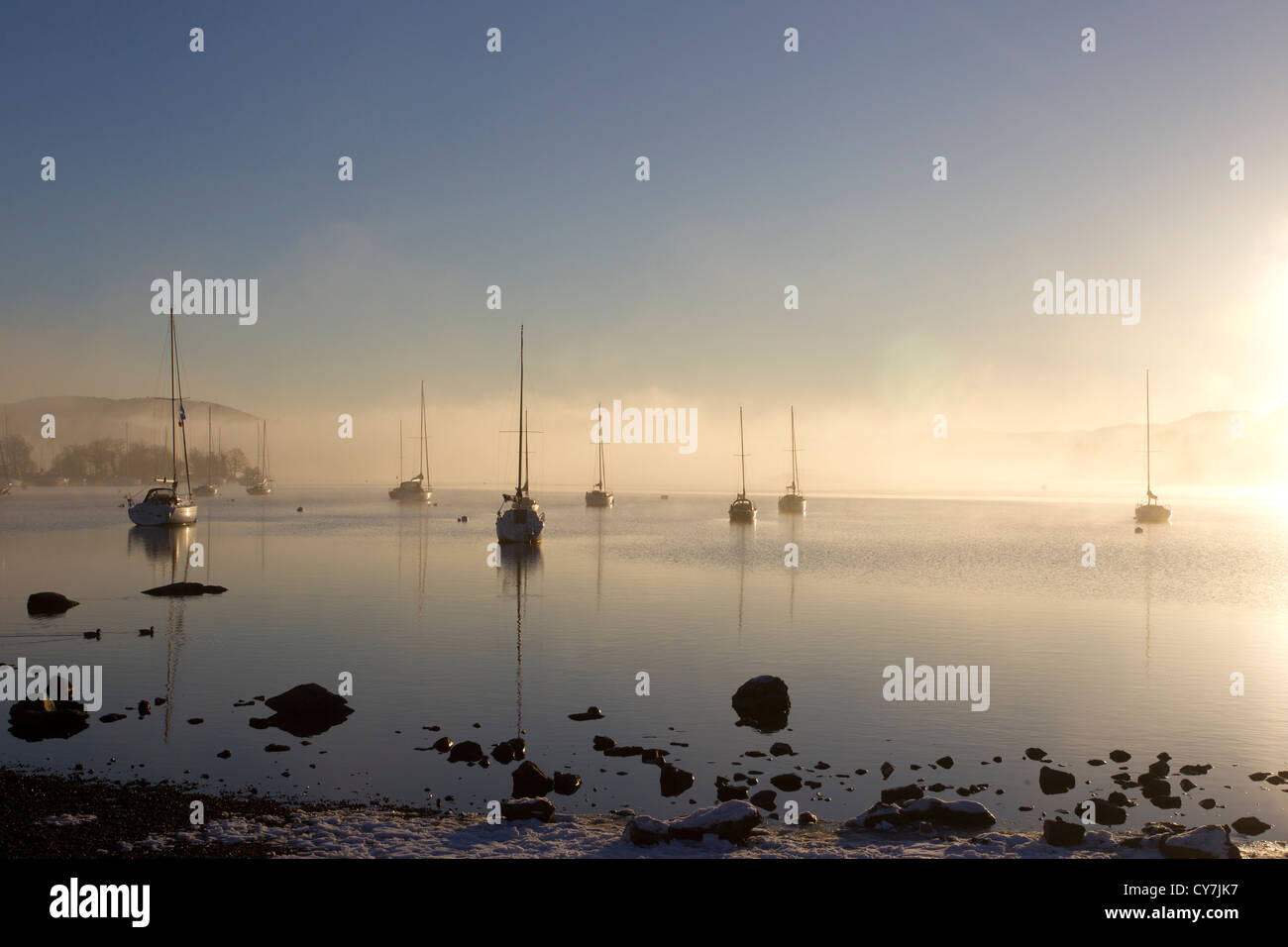 Low mist over Lake Windermere and yachts Stock Photo - Alamy