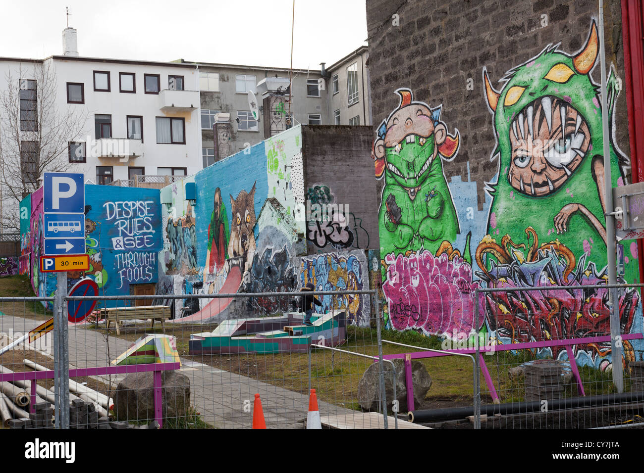 A child plays in a playground covered in graffiti in Reykjavik in ...