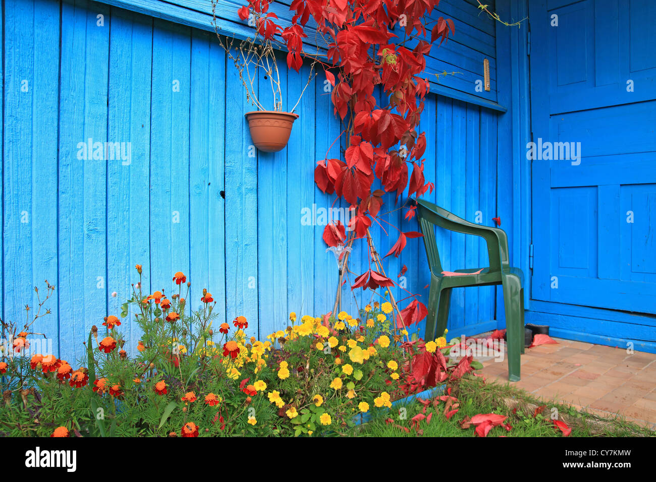 red sheet on wall of the rural building Stock Photo - Alamy