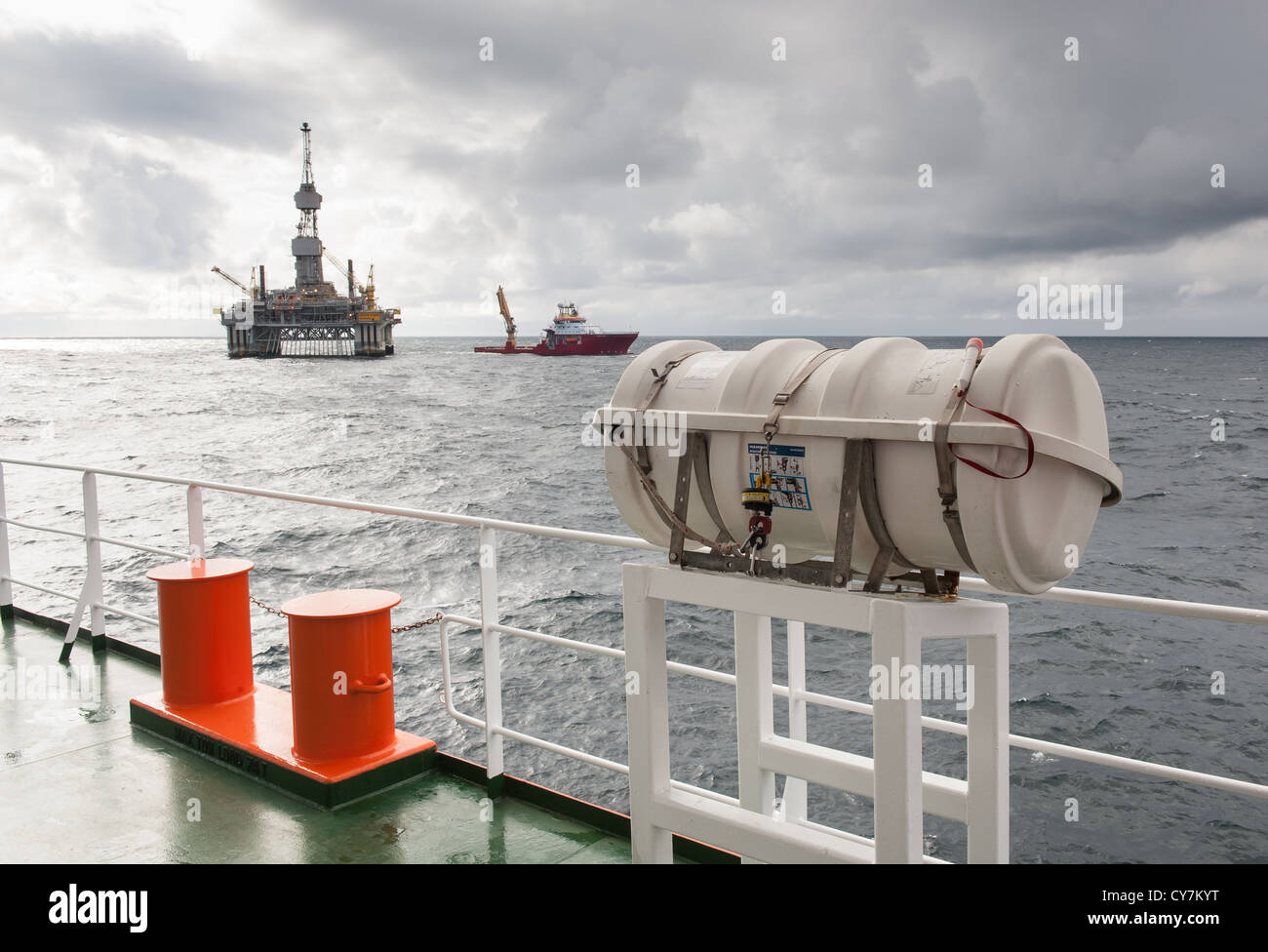 Live raft with oil rig and supply boat in the background on the North ...
