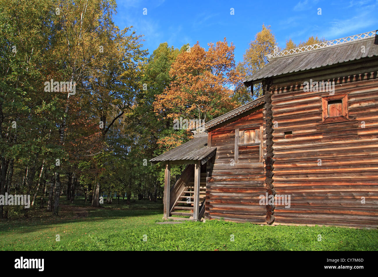 rural wooden house amongst autumn wood Stock Photo - Alamy