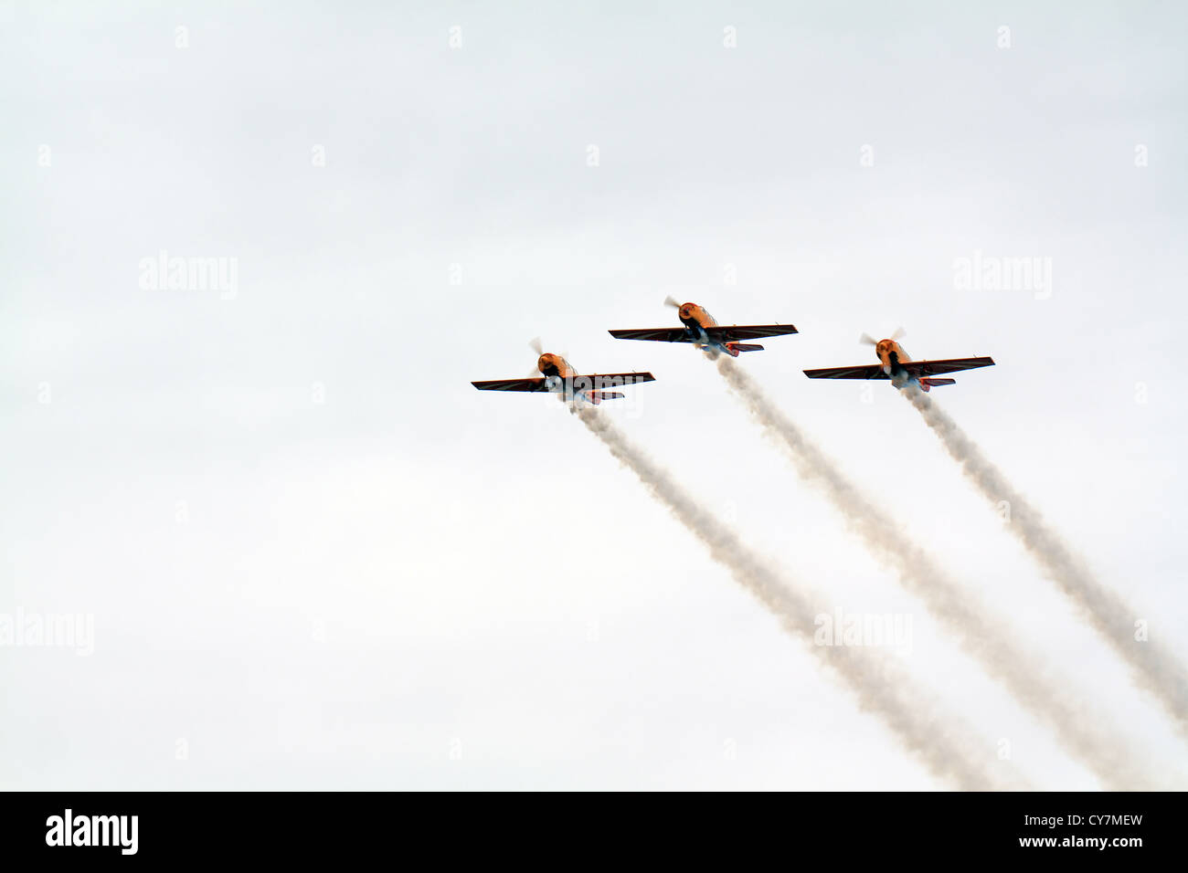 three planes in cloudy sky Stock Photo - Alamy