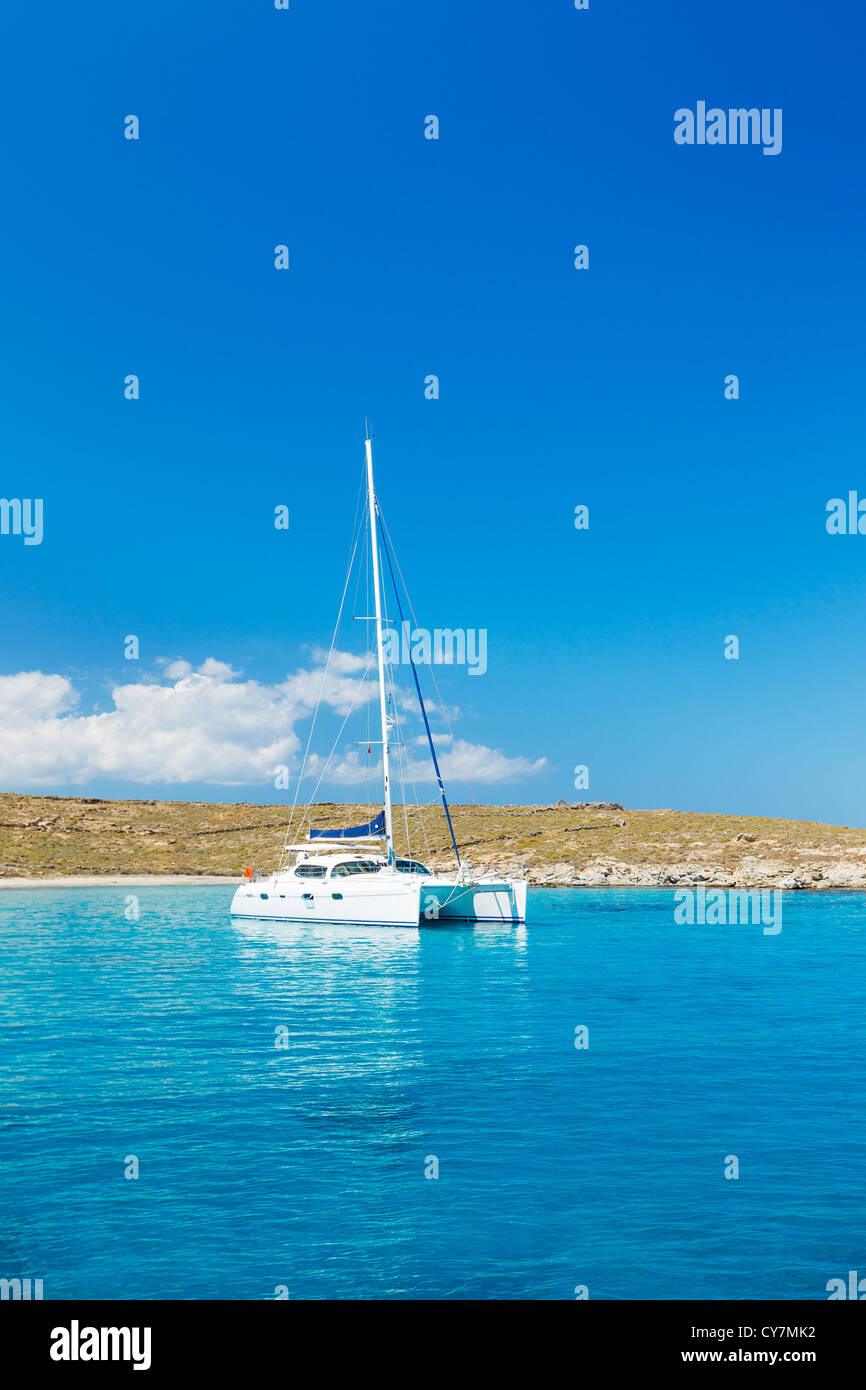 Sailboat in Beautiful Blue Ocean Stock Photo - Alamy