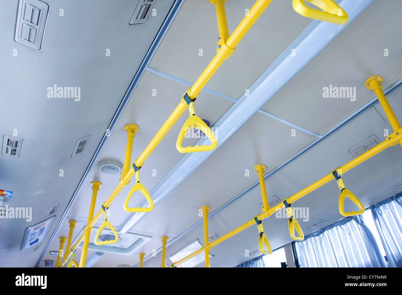Handles standing passenger inside bus transportation hi-res stock ...