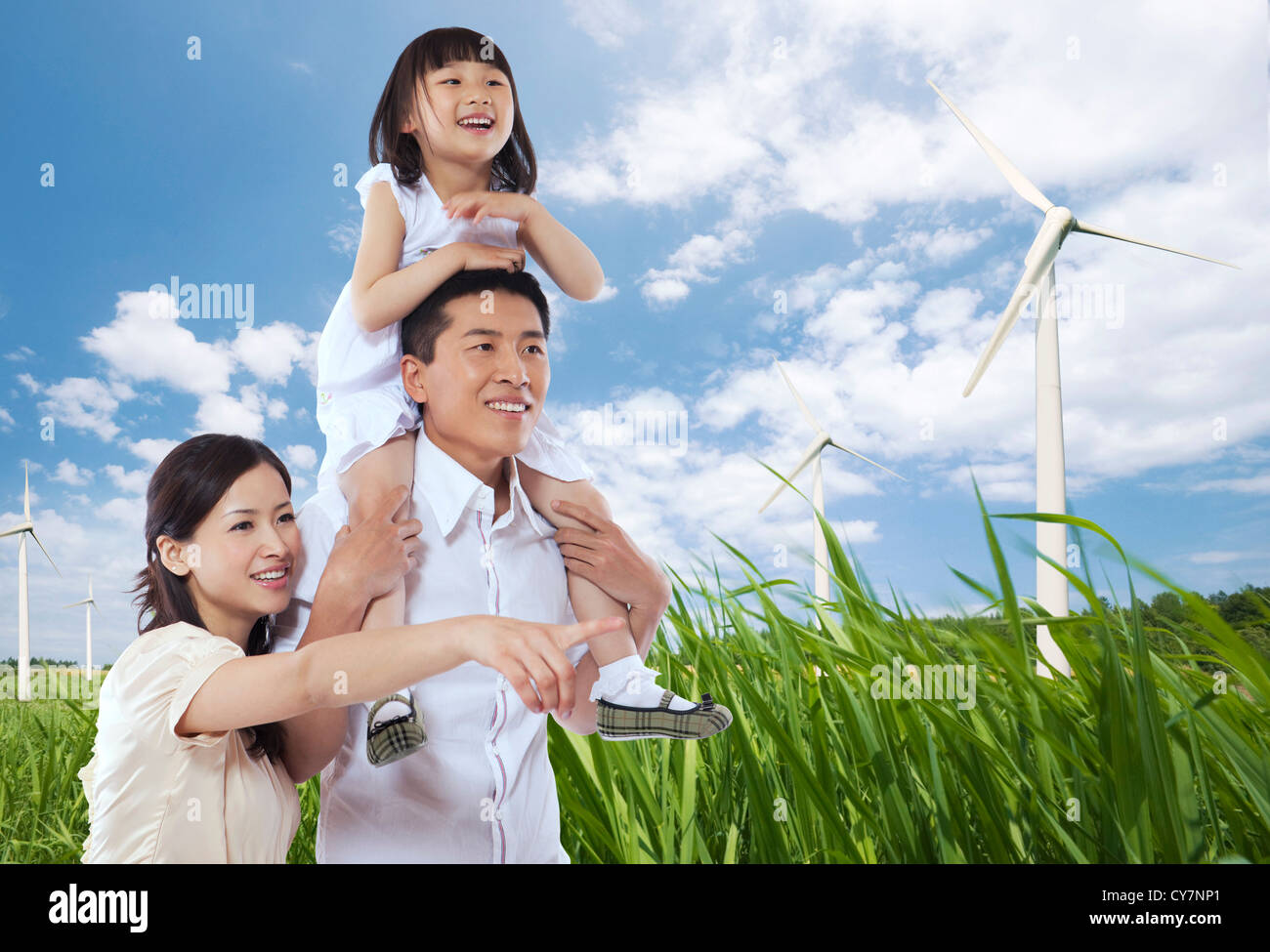 A family of three and the windmill Stock Photo - Alamy