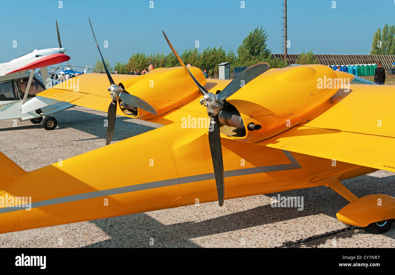 Light two-engine airplane for cruising and training on yellow colour ...