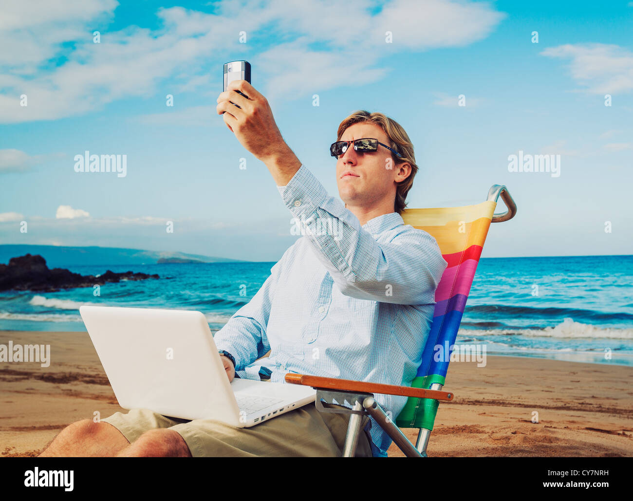 Young Business Man Working Remotely on Tropical Beach Stock Photo - Alamy