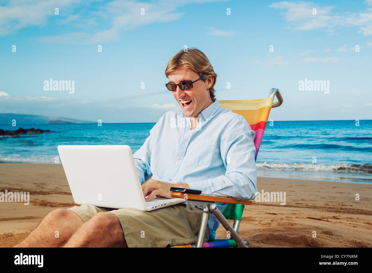 Young Business Man Working Remotely on Tropical Beach Stock Photo - Alamy
