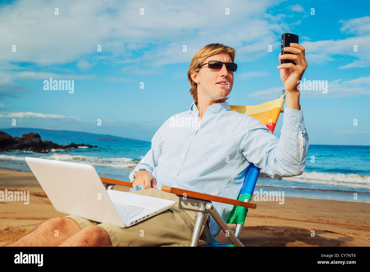Young Business Man Working Remotely on Tropical Beach Stock Photo - Alamy