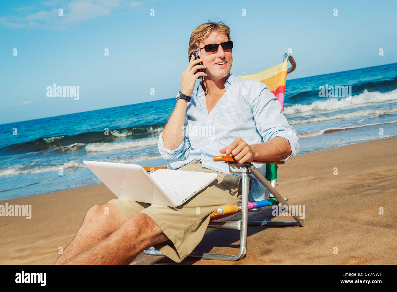 Young Business Man Working Remotely on Tropical Beach Stock Photo - Alamy