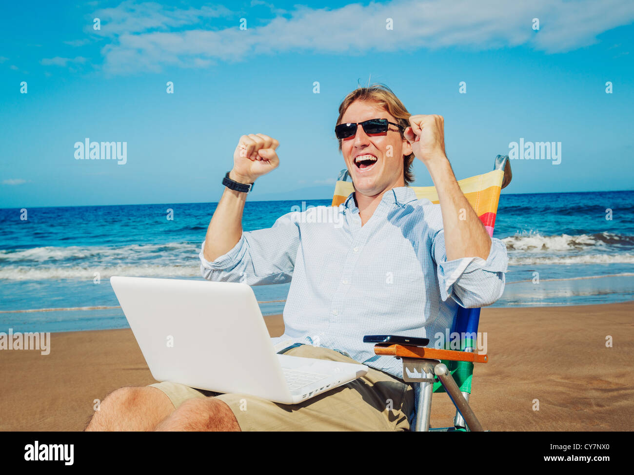Young Business Man Working Remotely on Tropical Beach Stock Photo - Alamy