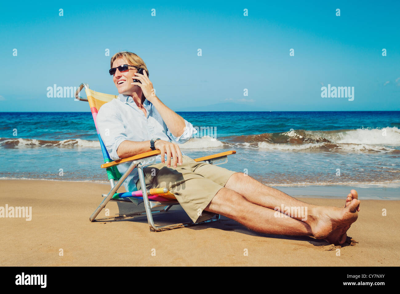 Young Business Man Working Remotely on Tropical Beach Stock Photo - Alamy