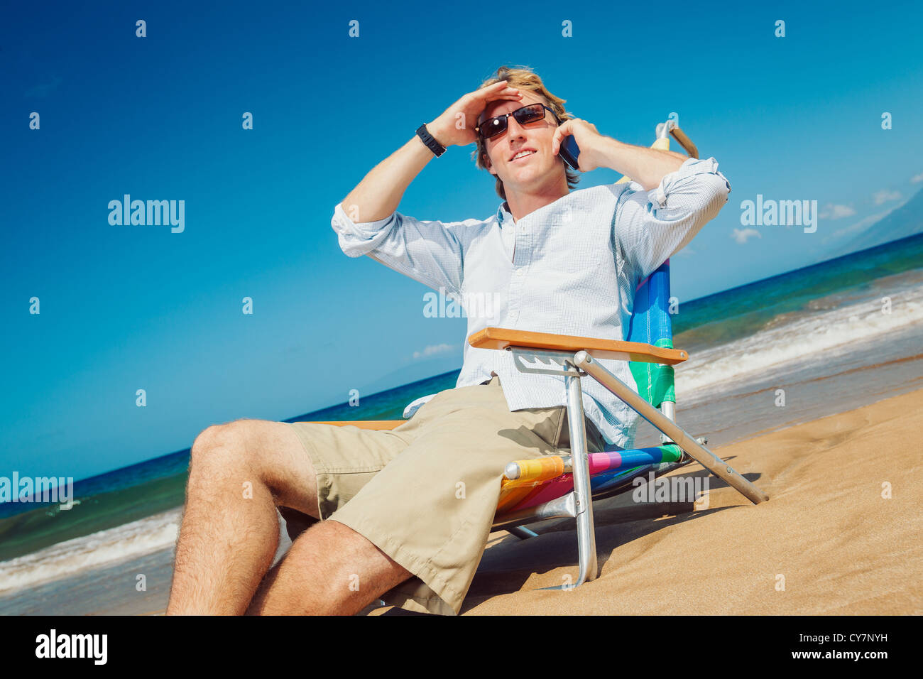 Young Business Man Working Remotely on Tropical Beach Stock Photo - Alamy