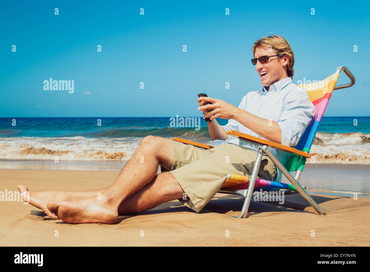 Young Business Man Working Remotely on Tropical Beach Stock Photo - Alamy