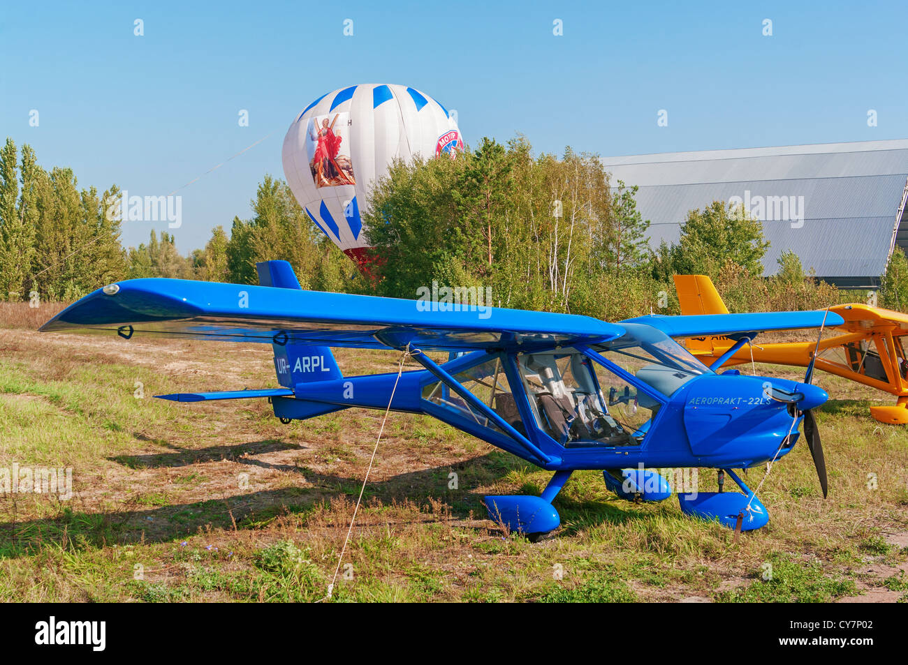 Light airplane for cruising and training on blue colour - general view ...