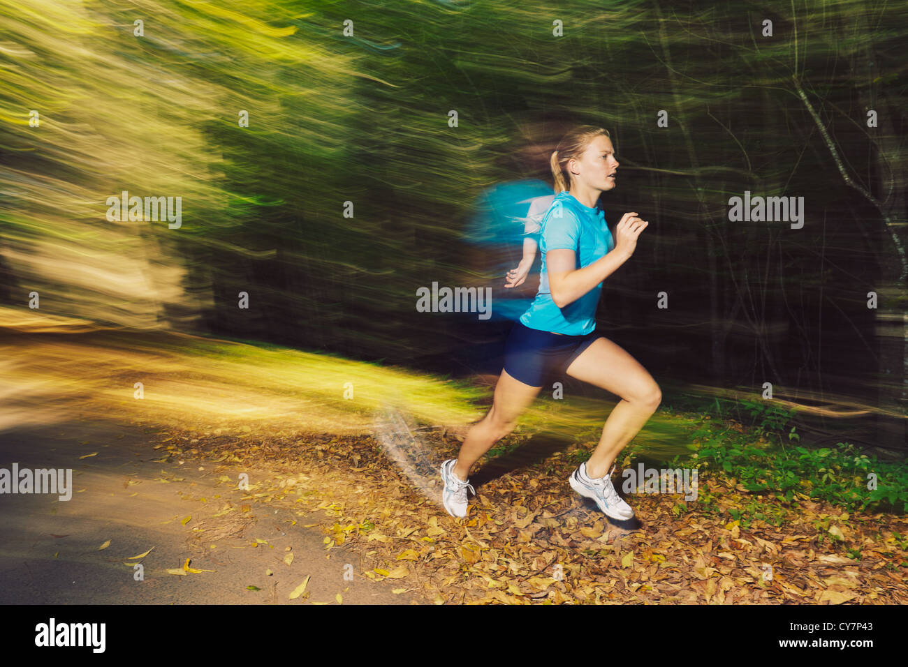 Woman Running Outdoors with Motion Blur Stock Photo - Alamy