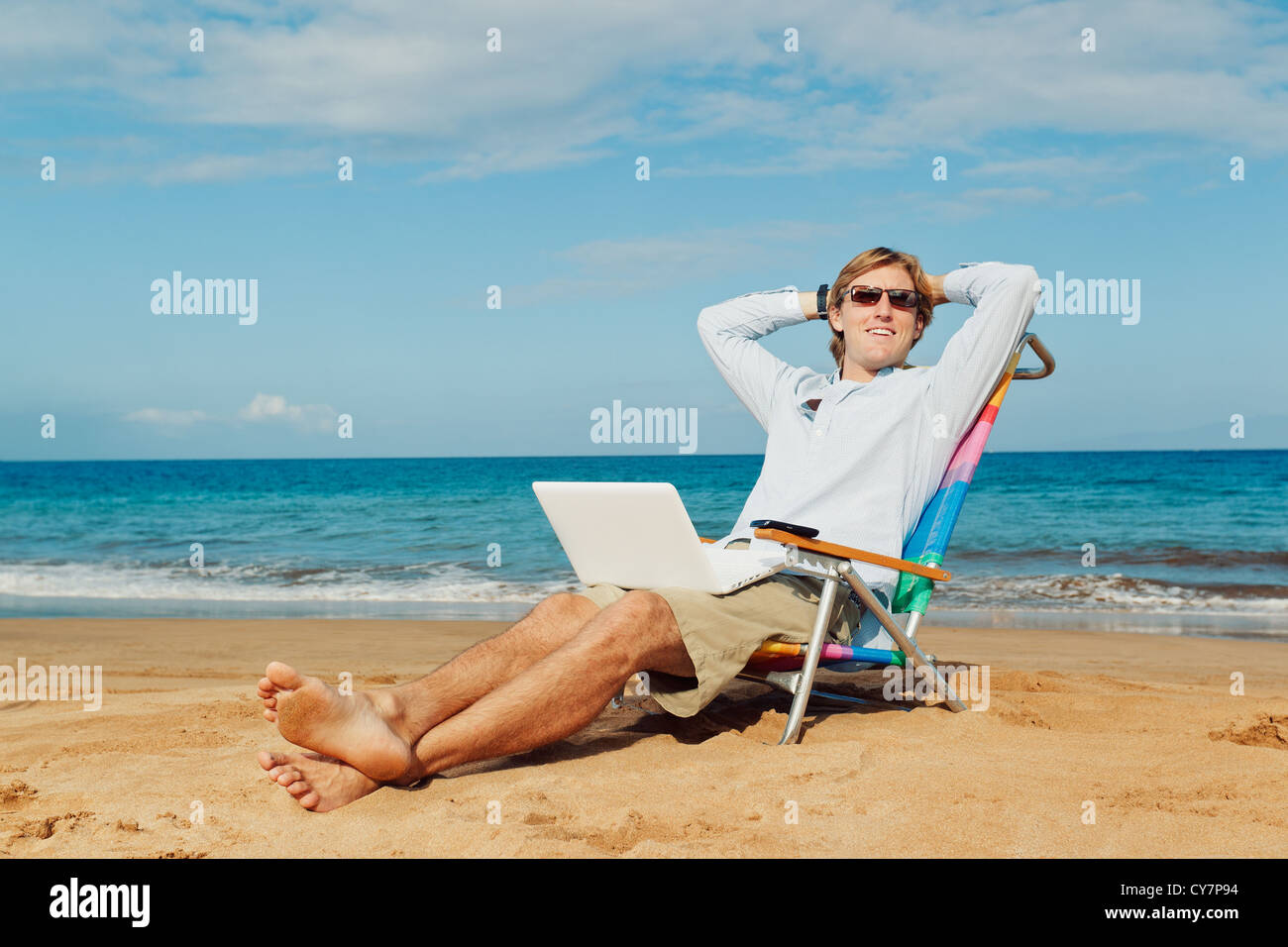 Young Attractive Man Relaxing at the Beach with Laptop Computer Stock ...